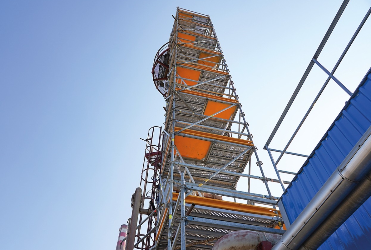 The 18-m-high stair tower was firmly anchored to the steel structure ...