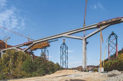 The cantilevered parapets on the west bridge were constructed in 24-m ...
